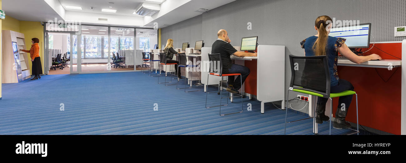 Panorama of modern college interior with functional workstations with ...