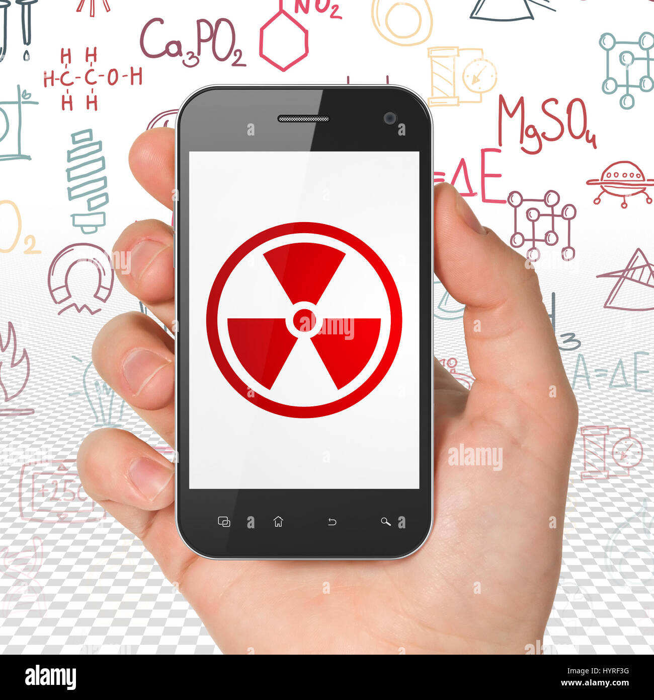Science concept: Hand Holding Smartphone with Radiation on display ...