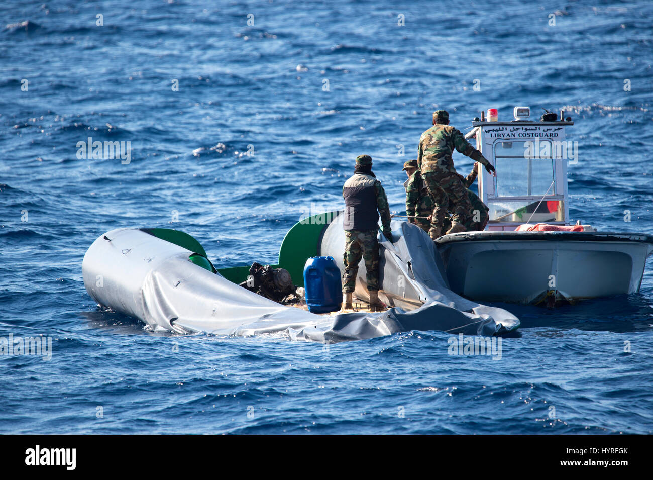 A small boat with 4 people, calling themself Libyan Coastguard was ...