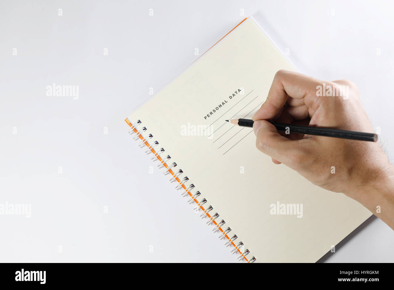 Pencil writting on notebook on white background Stock Photo - Alamy
