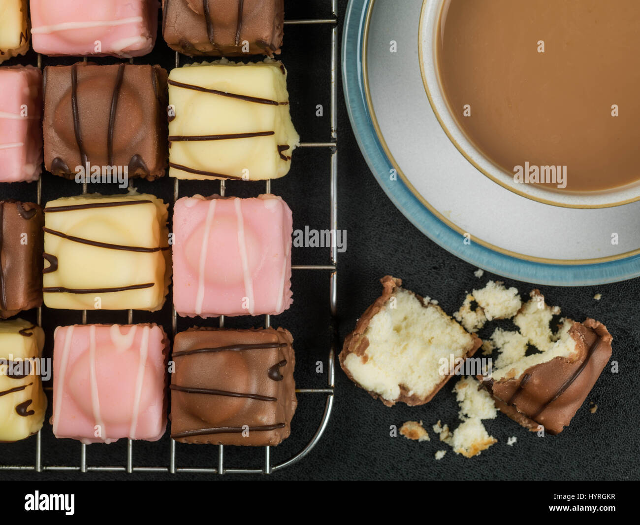 Iced Fondant Fancy Sponge Cakes Against a Black Background Stock Photo ...