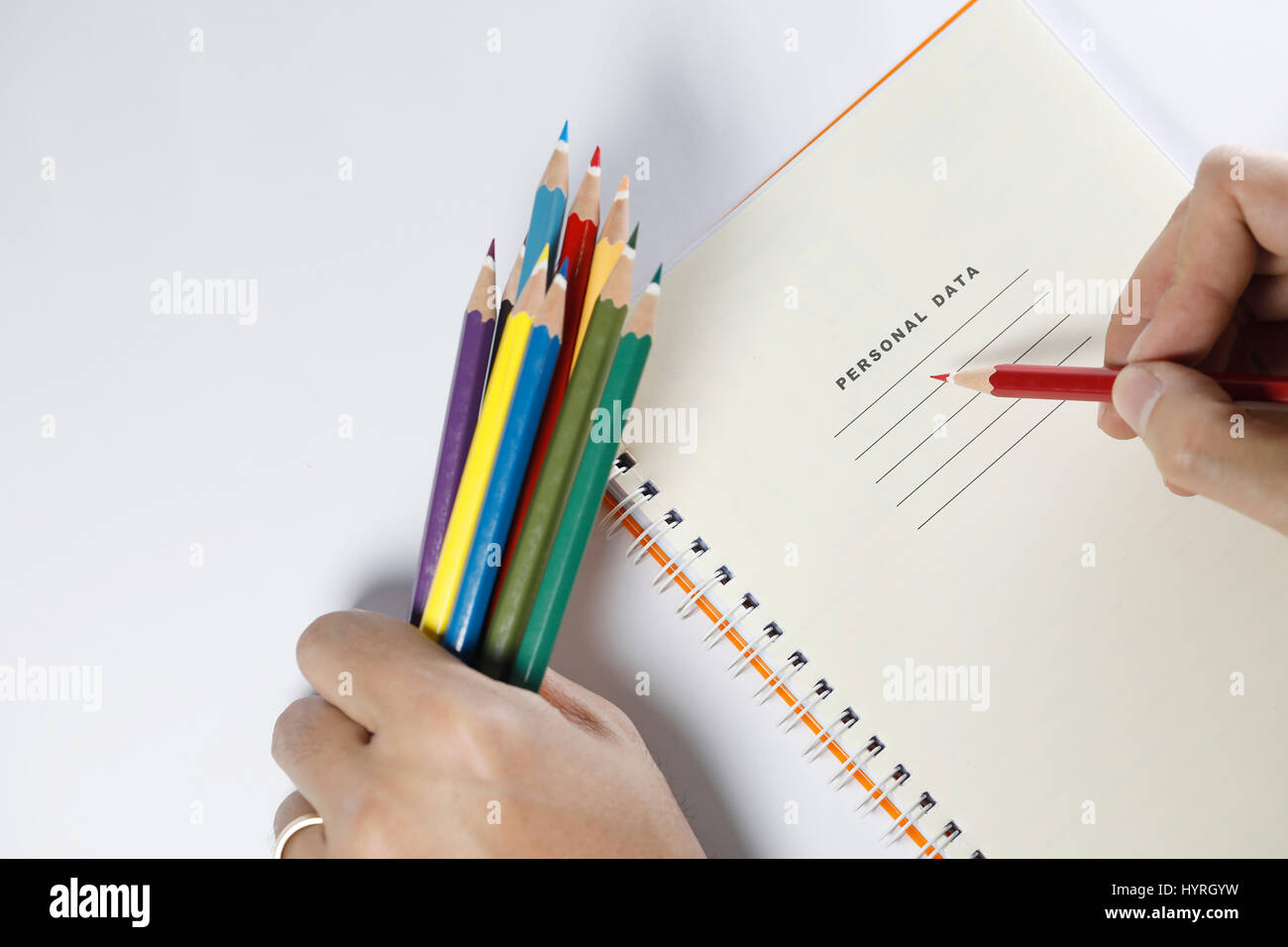 Pencil writting on notebook on white background Stock Photo - Alamy