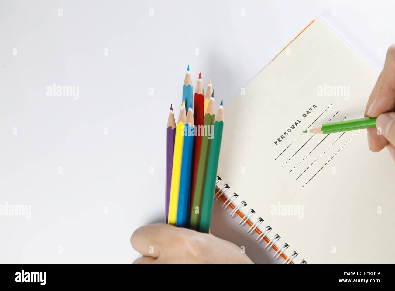 Pencil writting on notebook on white background Stock Photo - Alamy