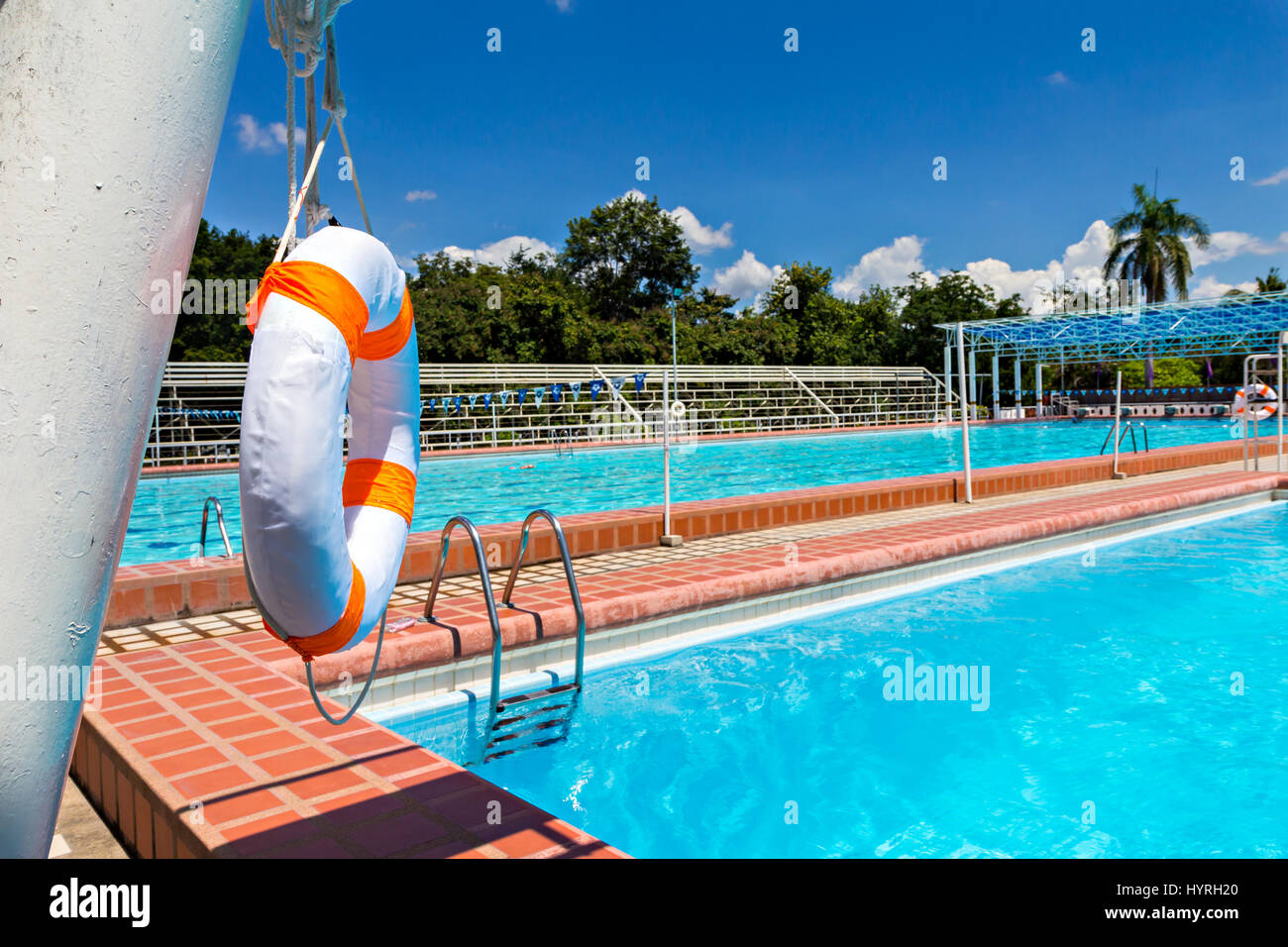 Life buoy in swimming pool Stock Photo - Alamy