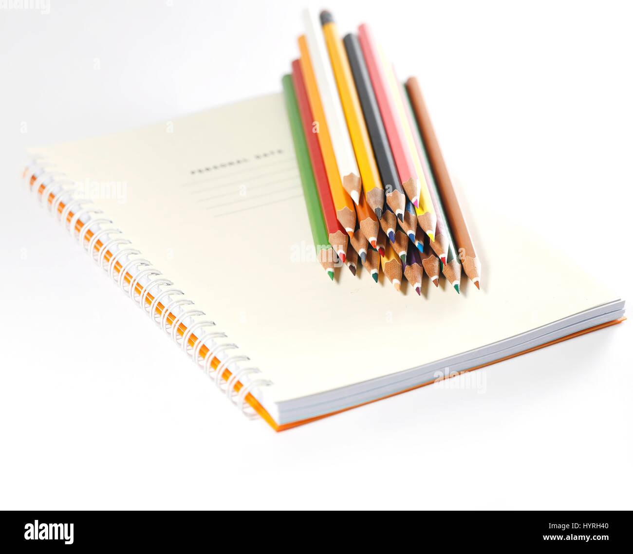 Pencil writting on notebook on white background Stock Photo - Alamy