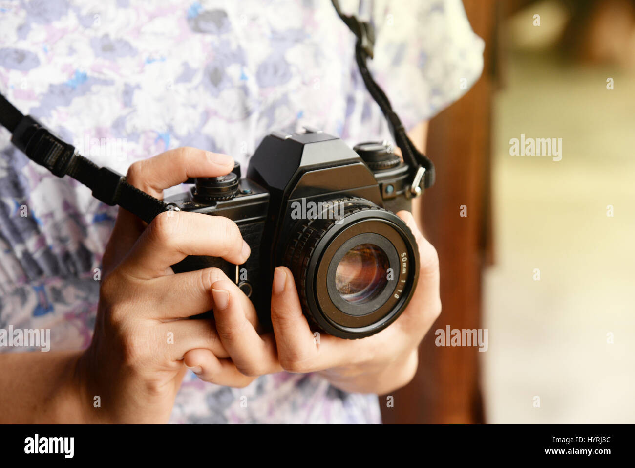 Woman hand holding retro camera close-up with copy space Stock Photo ...