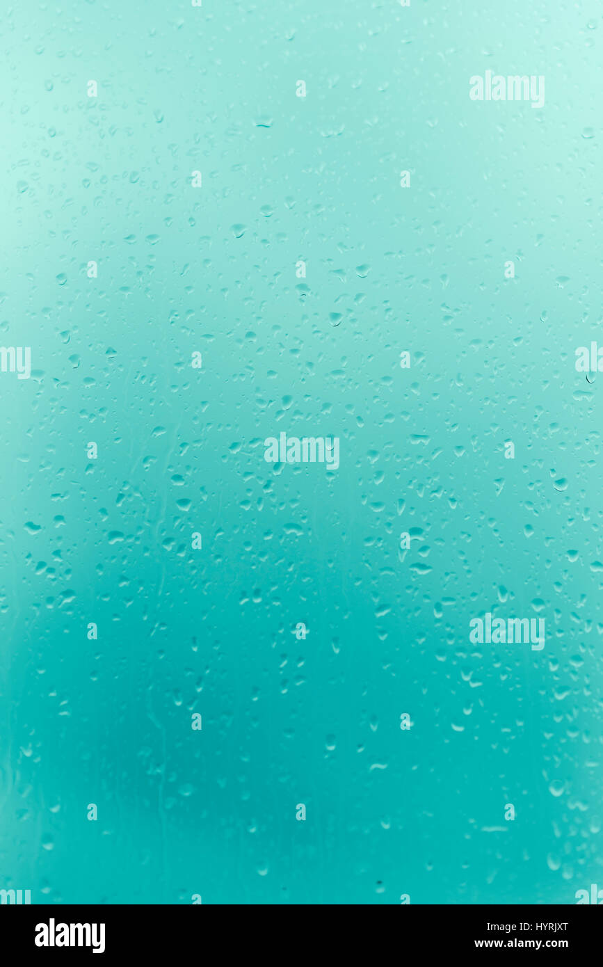 Raindrops on glass, spectacular sky background with color effect Stock ...