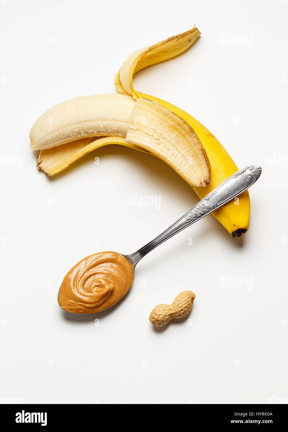 Banana With Peanut Butter On Spoon Stock Photo - Alamy