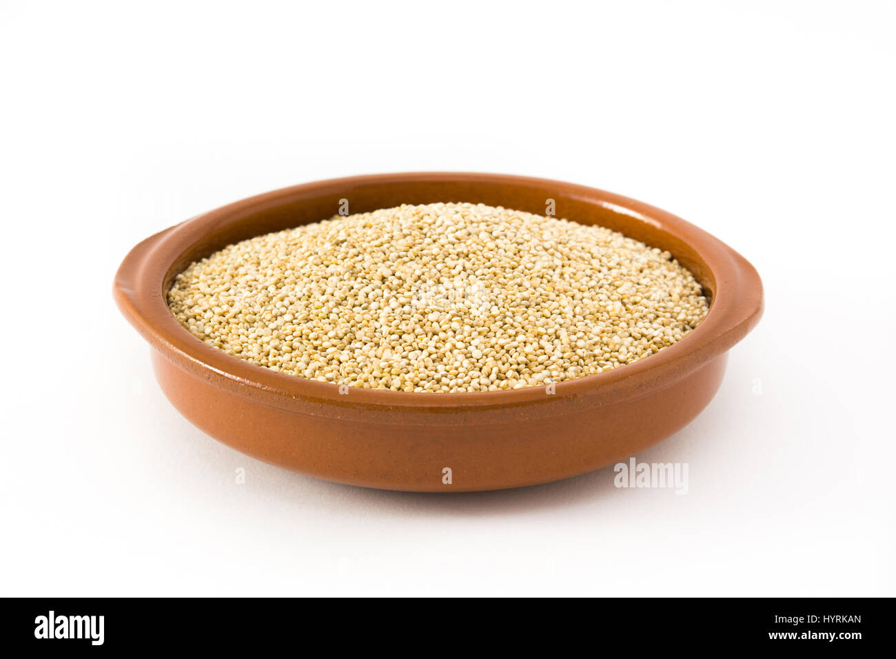 Quinoa in a bowl isolated on white background Stock Photo - Alamy