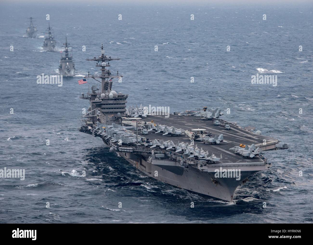 The USN Nimitz-class aircraft carrier USS Carl Vinson leads a formation ...