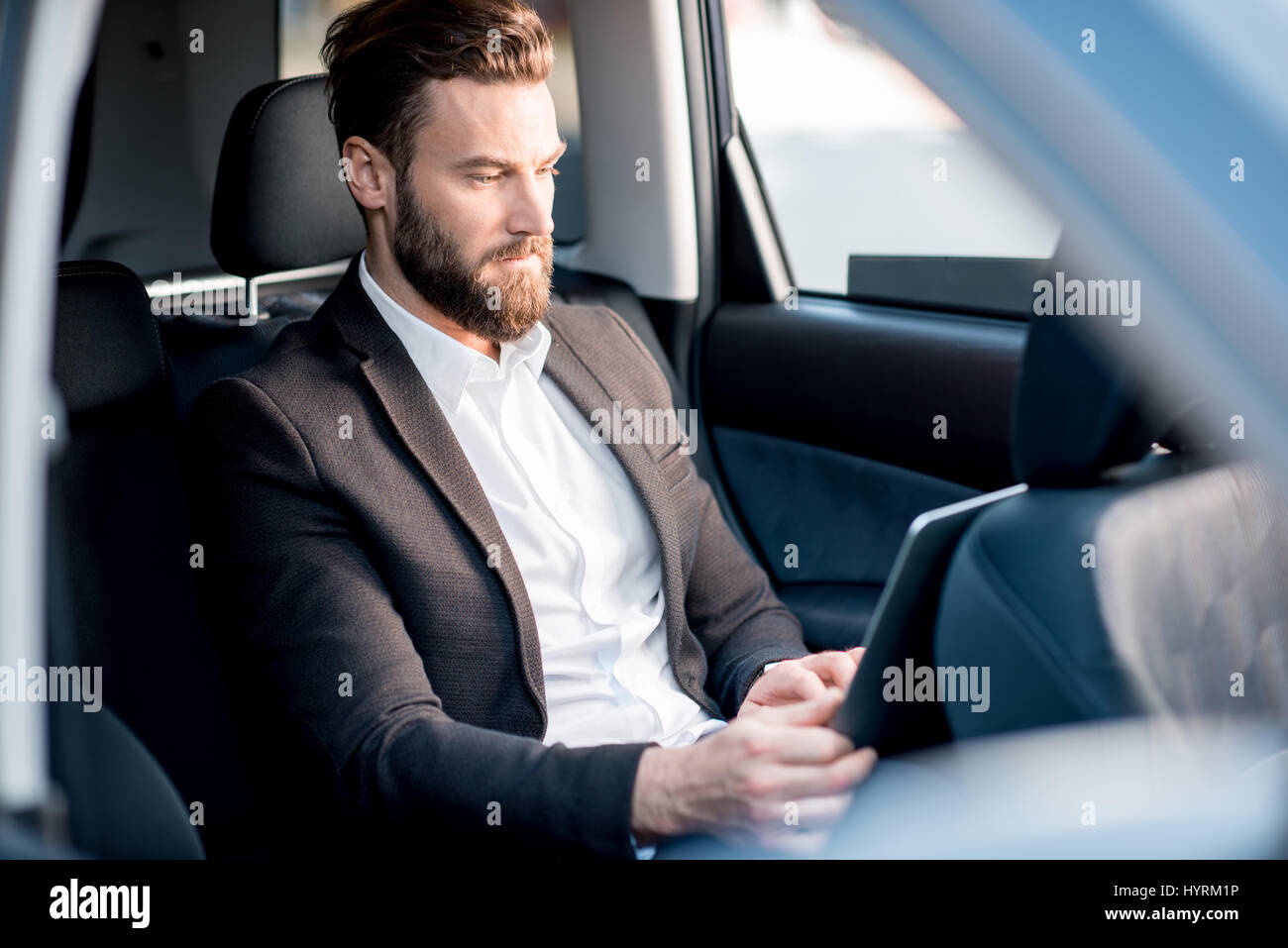 Businessman in the car Stock Photo - Alamy