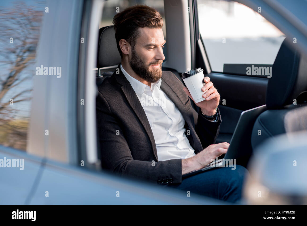 Businessman in the car Stock Photo - Alamy