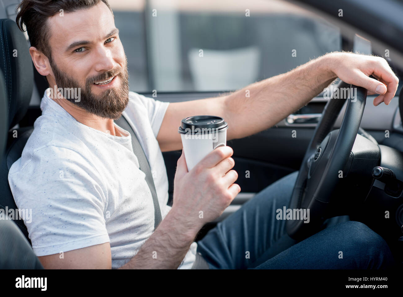 Man drinking coffee driving car hi-res stock photography and images - Alamy