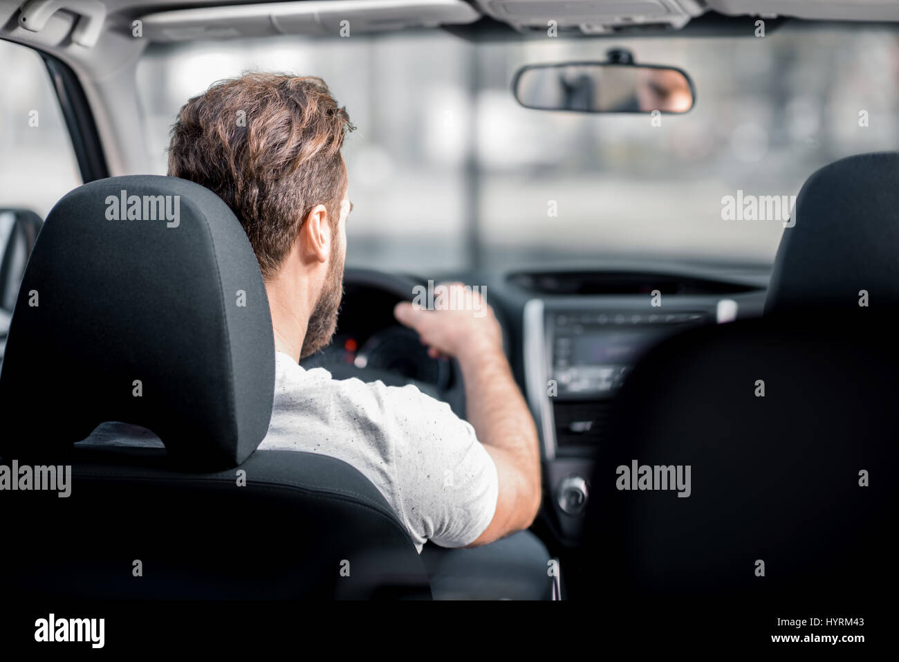 Rear view caucasian man driving hi-res stock photography and images - Alamy