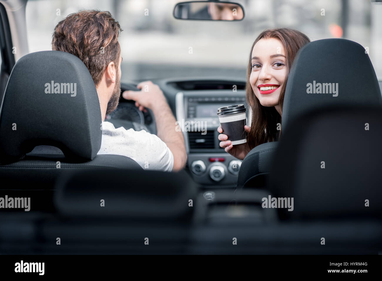 Happy couple in the car Stock Photo - Alamy