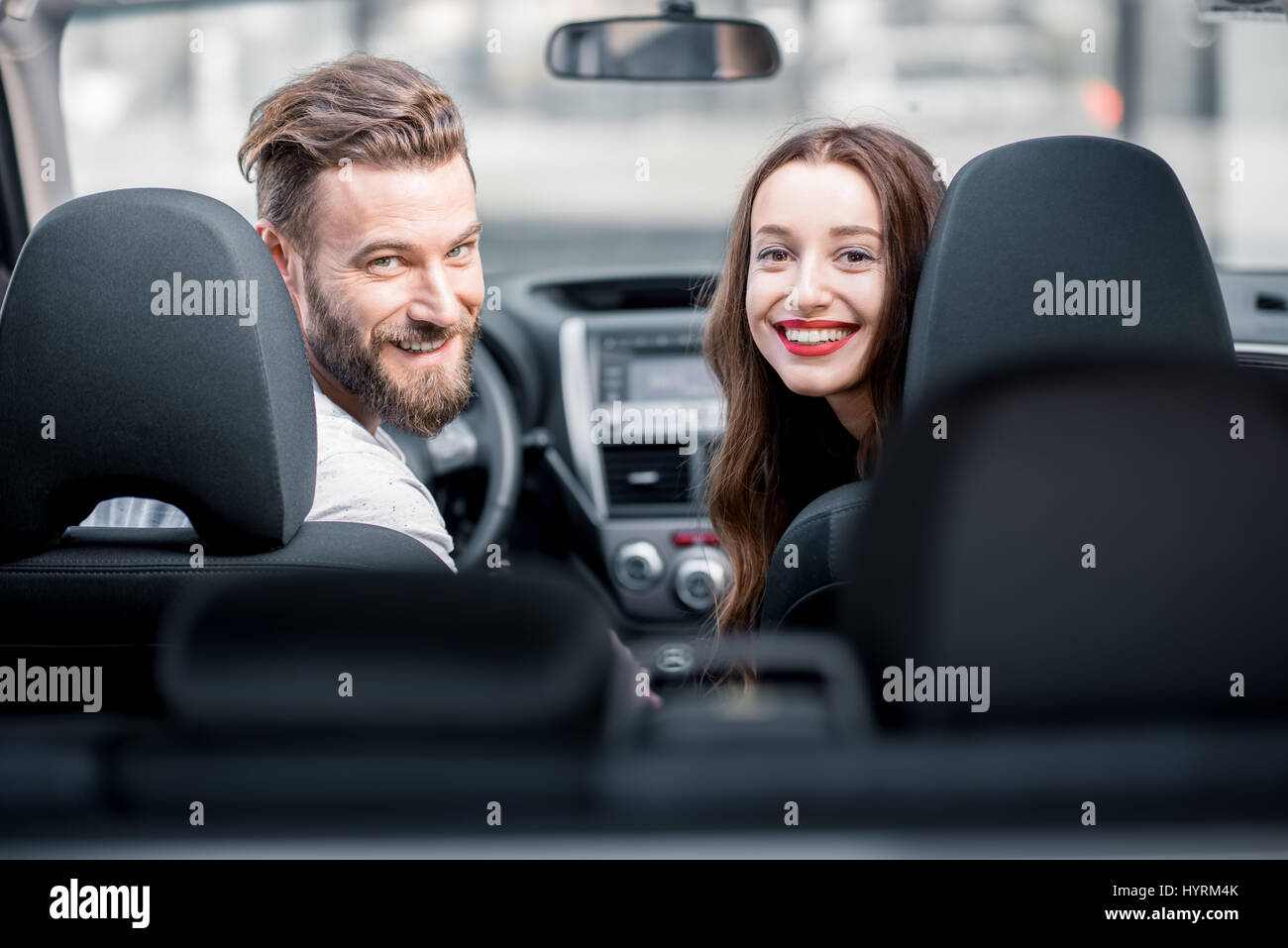 Happy couple in the car Stock Photo - Alamy