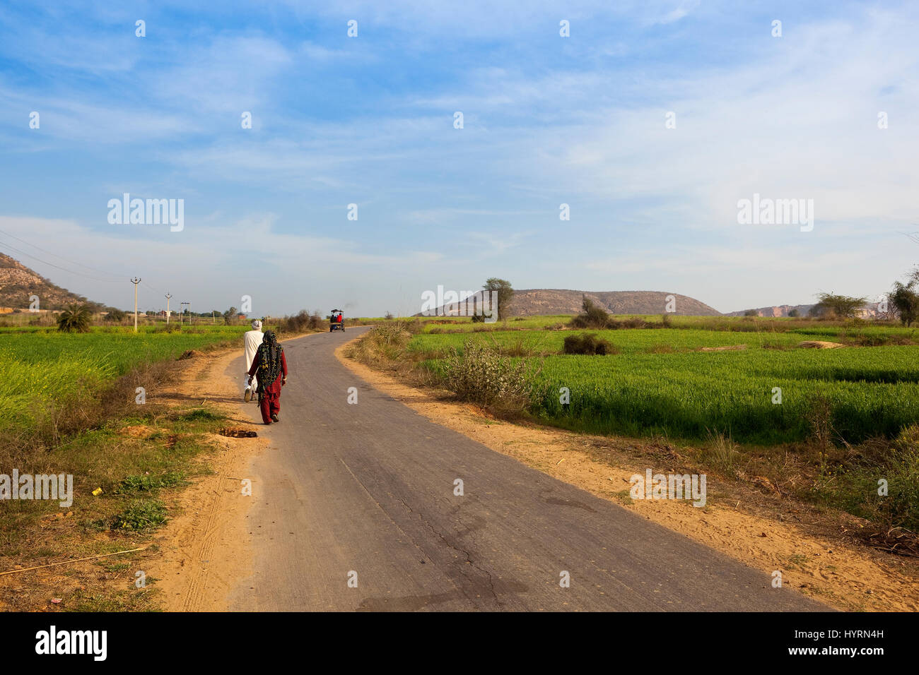 local people in tijara rajasthan india walking down a rural road in ...
