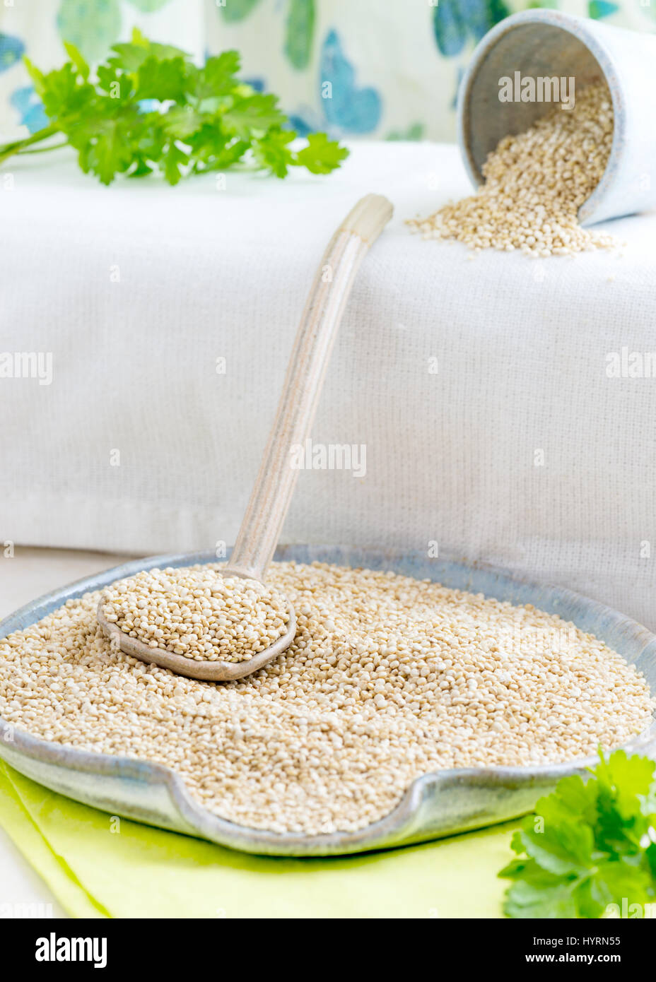 vertical composition of quinoa in ceramic pottery. blue and green ...