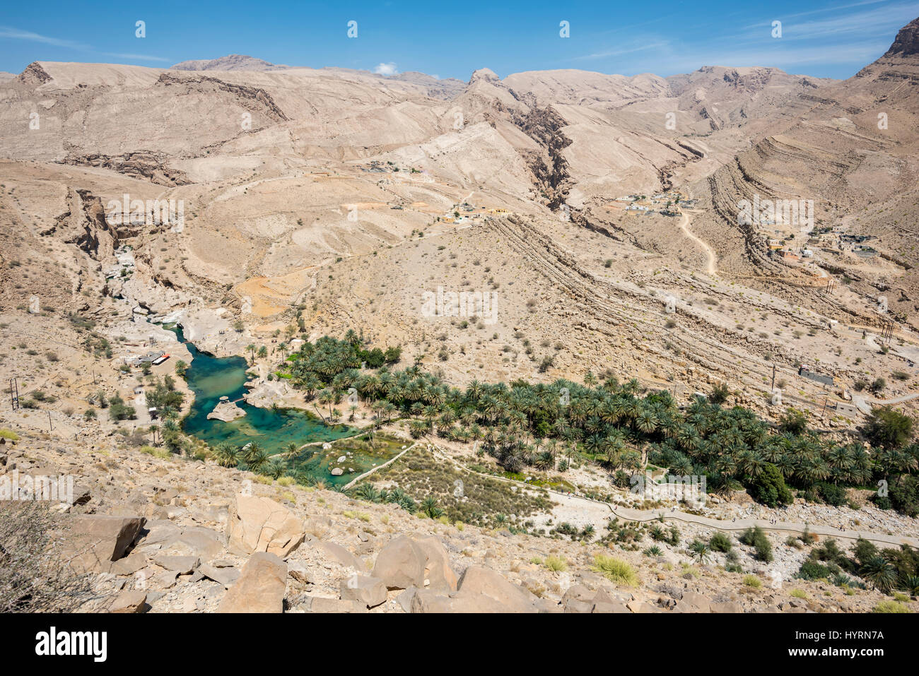 Top view of Wadi Bani Khalid in Oman, with a turquoise pool and ...