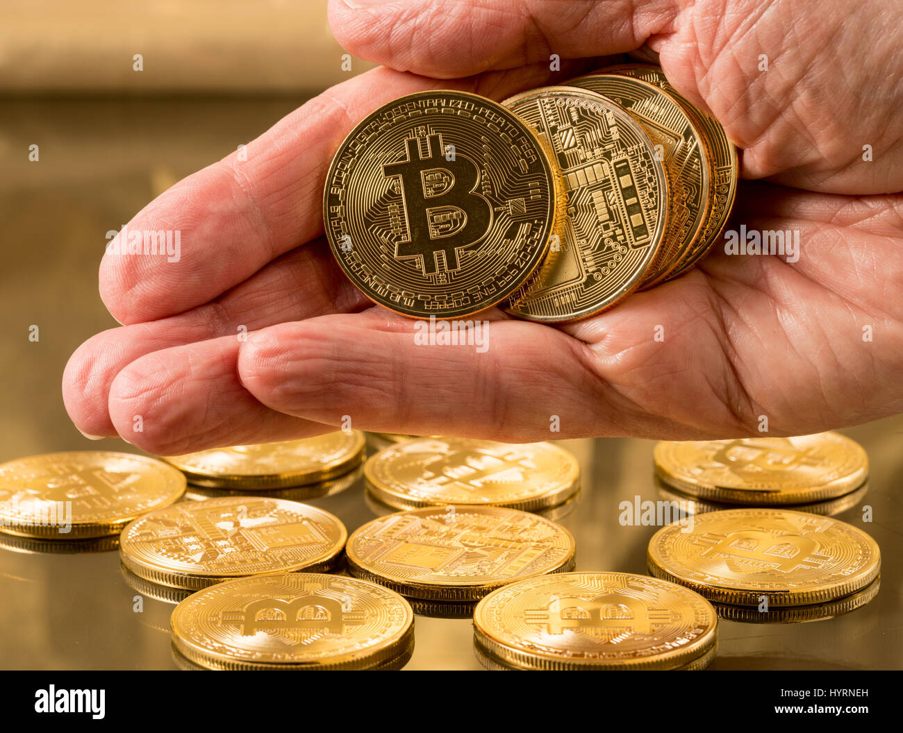 Stack of bitcoins with gold background Stock Photo - Alamy