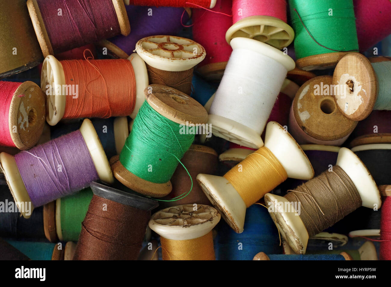colorful bobbins of thread as background Stock Photo - Alamy