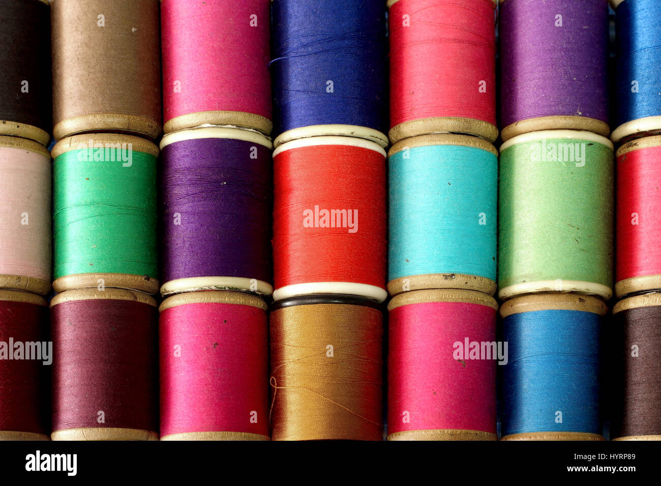 colorful bobbins of thread as background Stock Photo - Alamy
