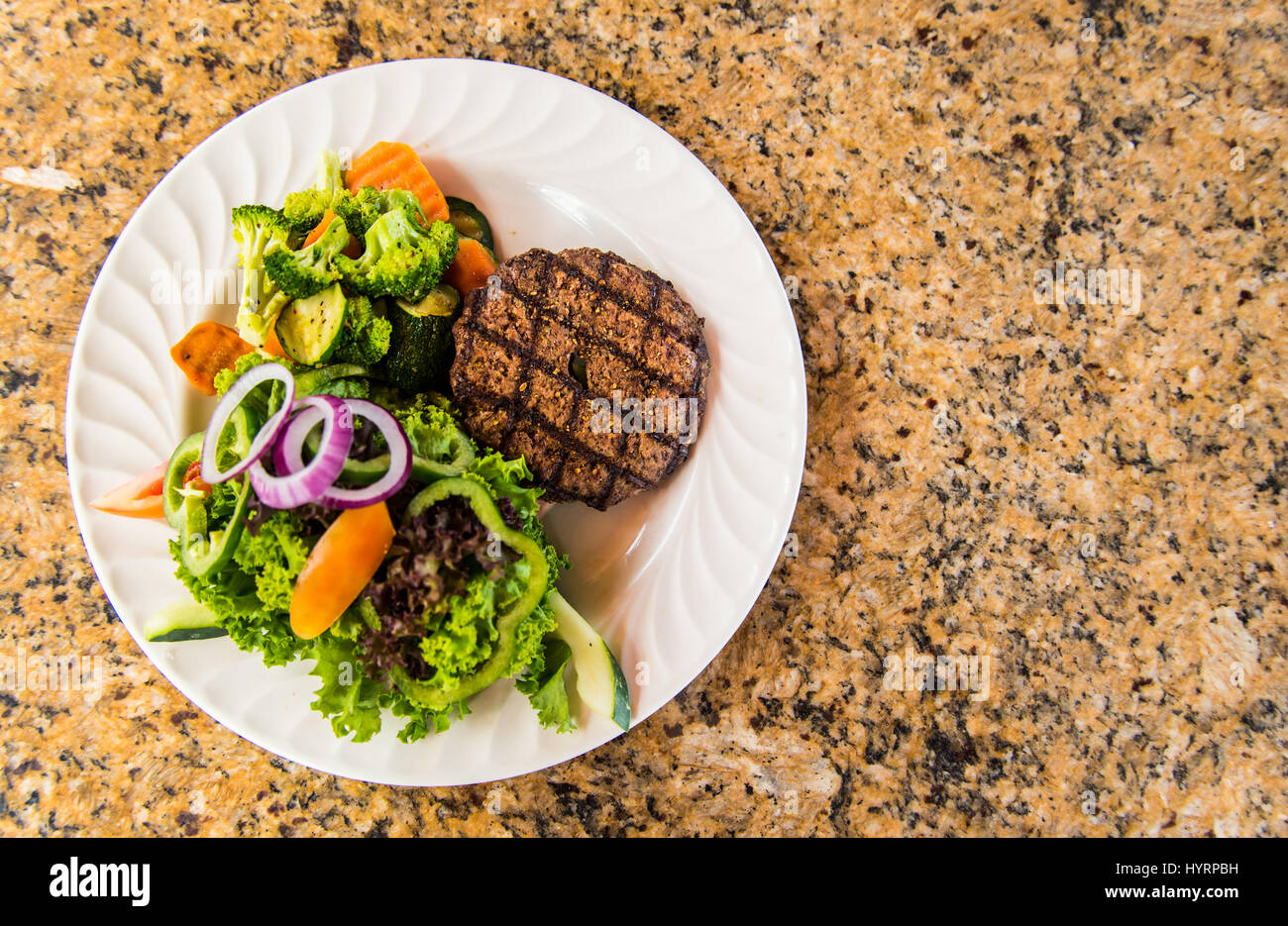 Meat Patty with salad and vegetables Stock Photo - Alamy