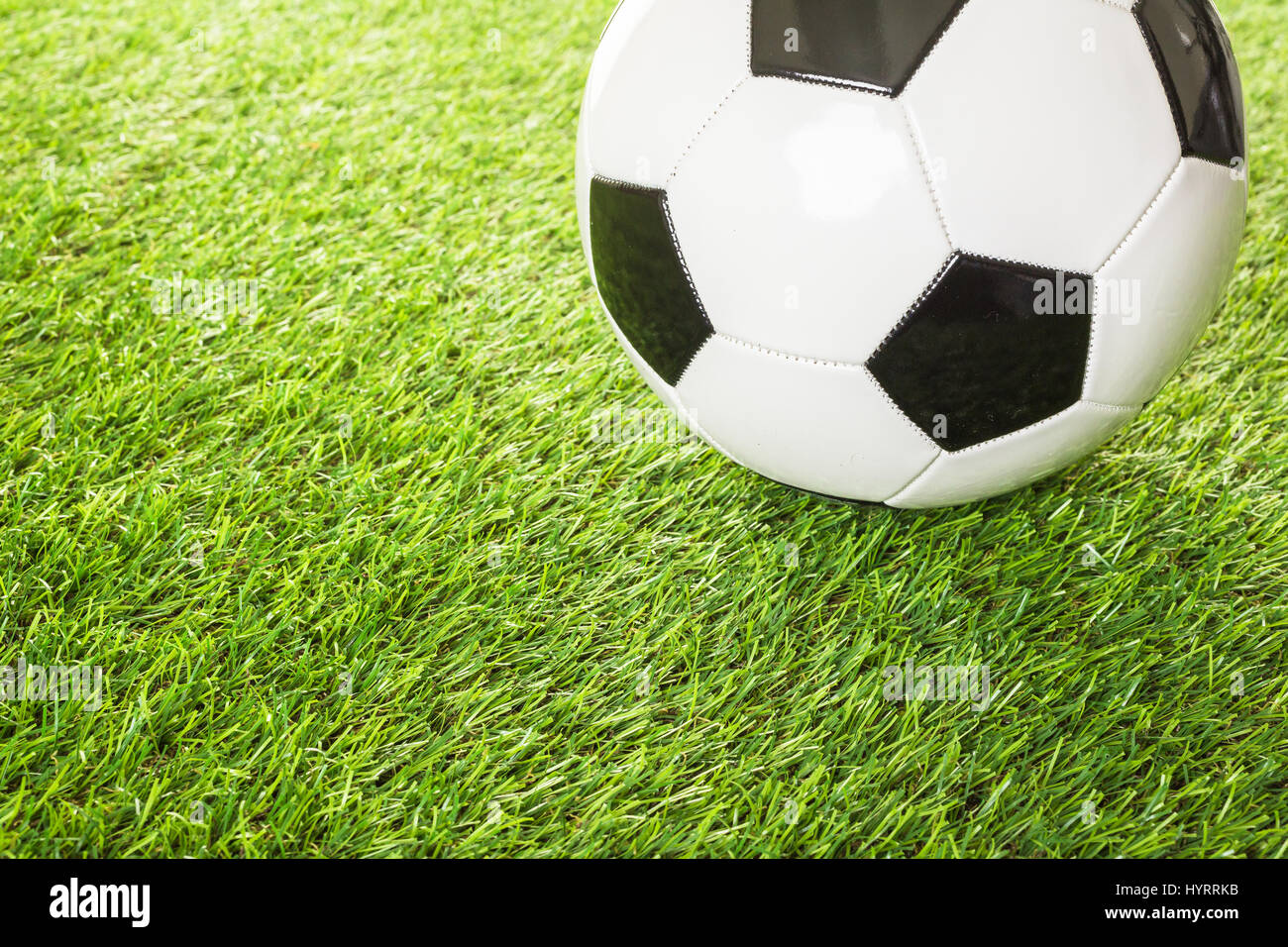 Football ball on a perfectly green grass Stock Photo - Alamy