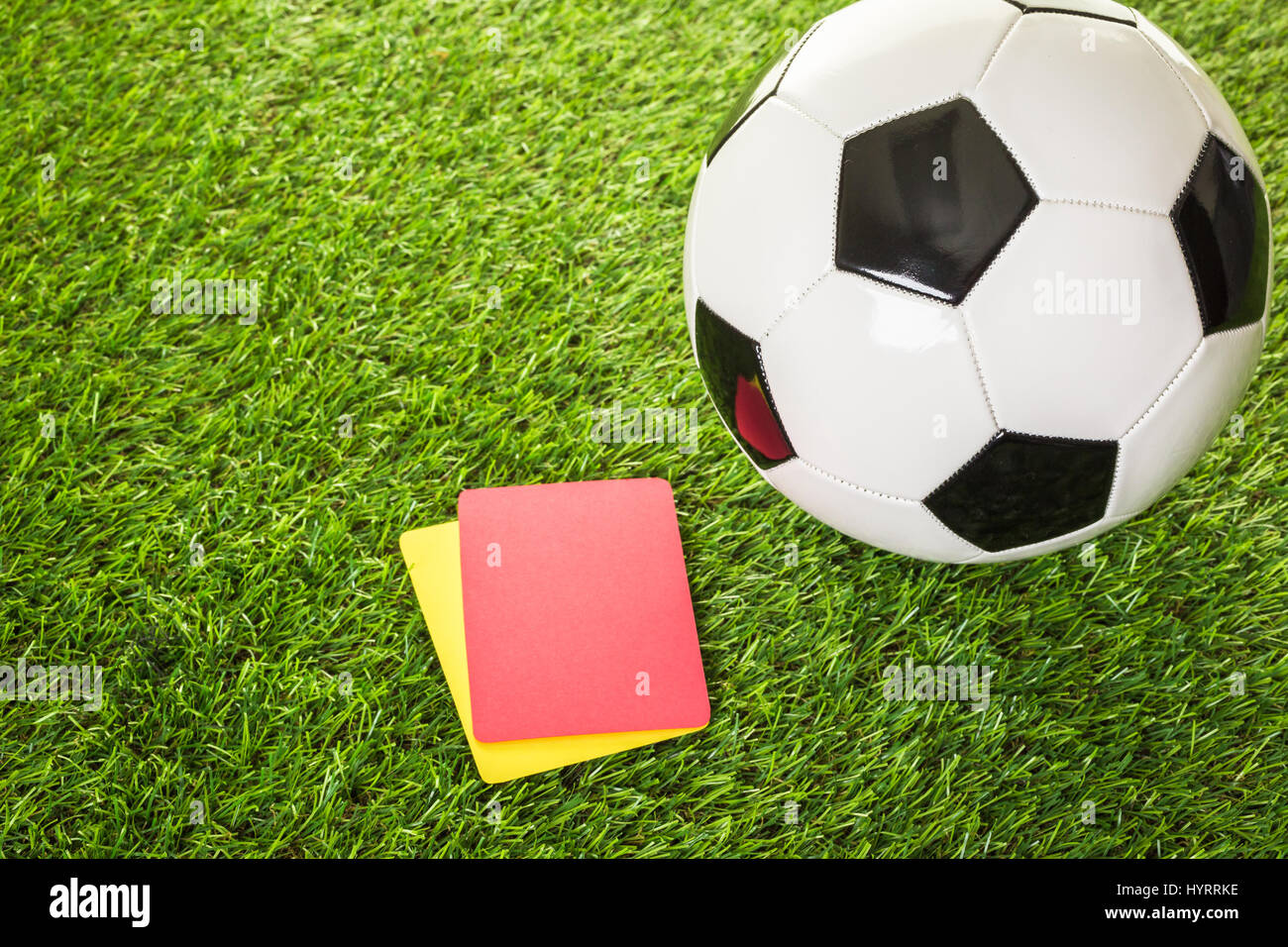 Football ball on a perfectly green grass Stock Photo - Alamy