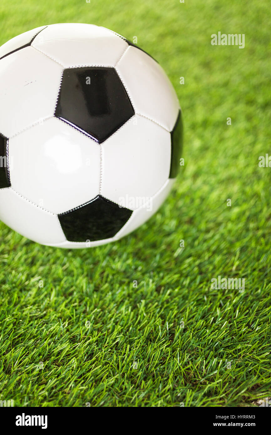 Football ball on a perfectly green grass Stock Photo - Alamy