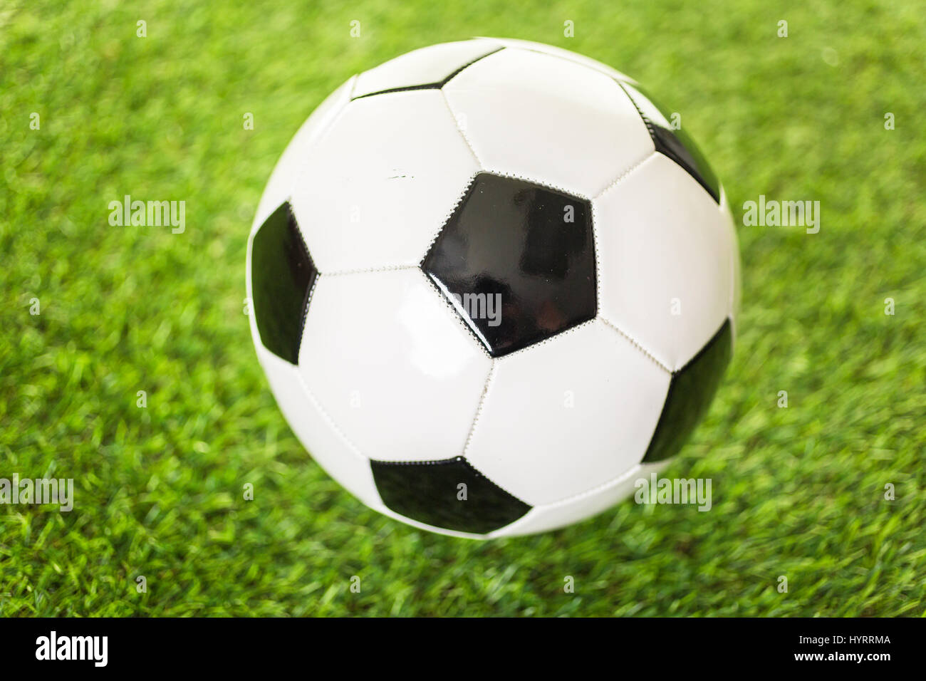 Football ball on a perfectly green grass Stock Photo - Alamy