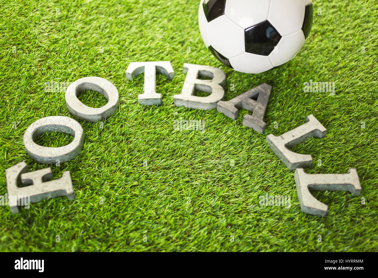 Football ball on a perfectly green grass Stock Photo - Alamy