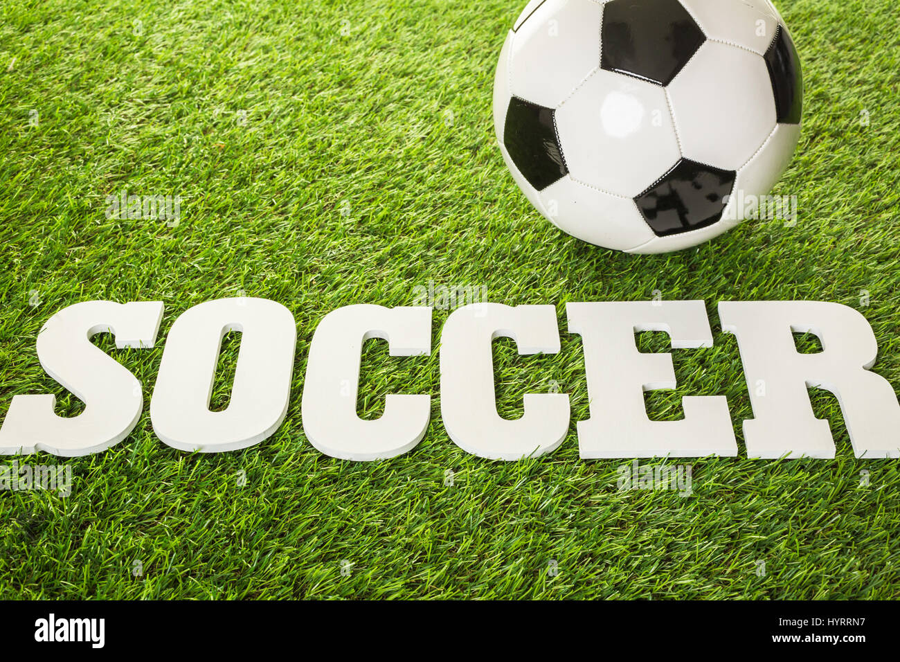 Football ball on a perfectly green grass Stock Photo - Alamy