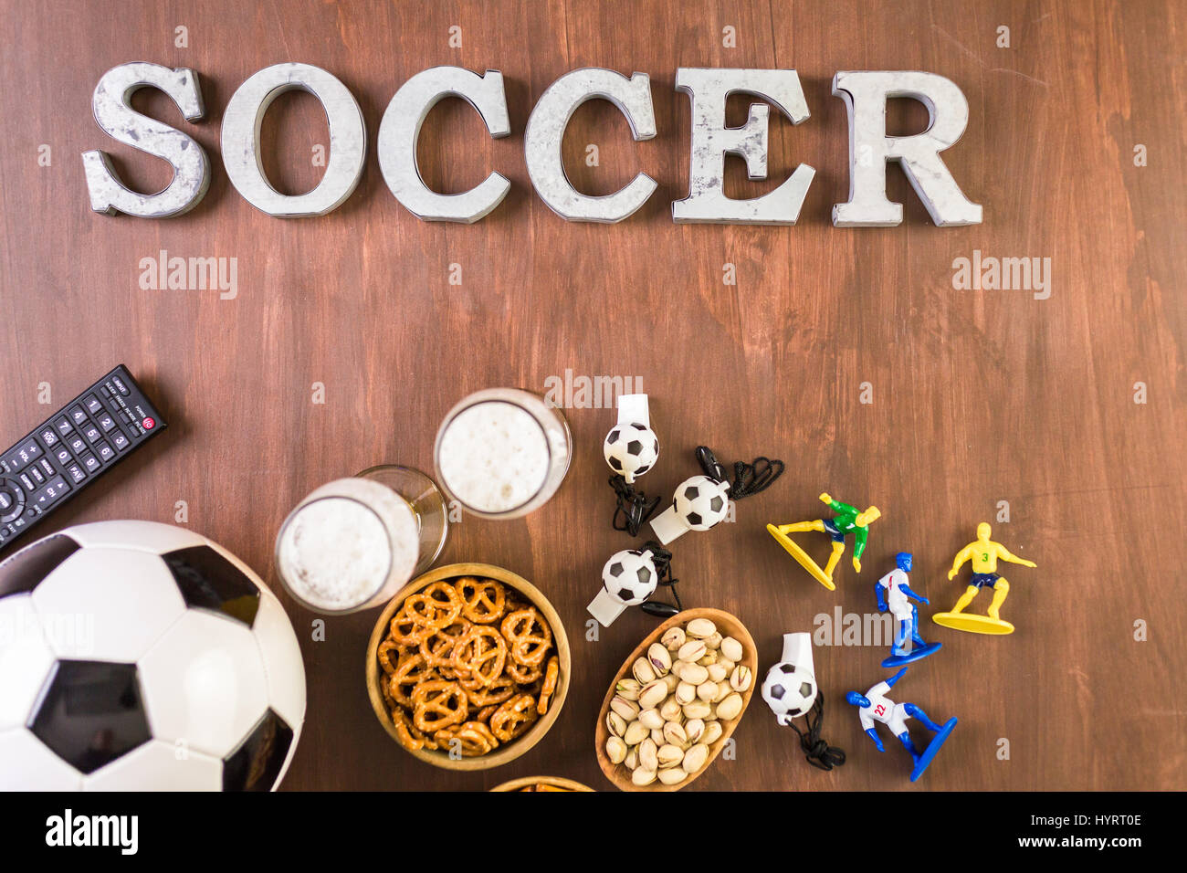 Salty snacks and drinks on the table for soccer party Stock Photo - Alamy