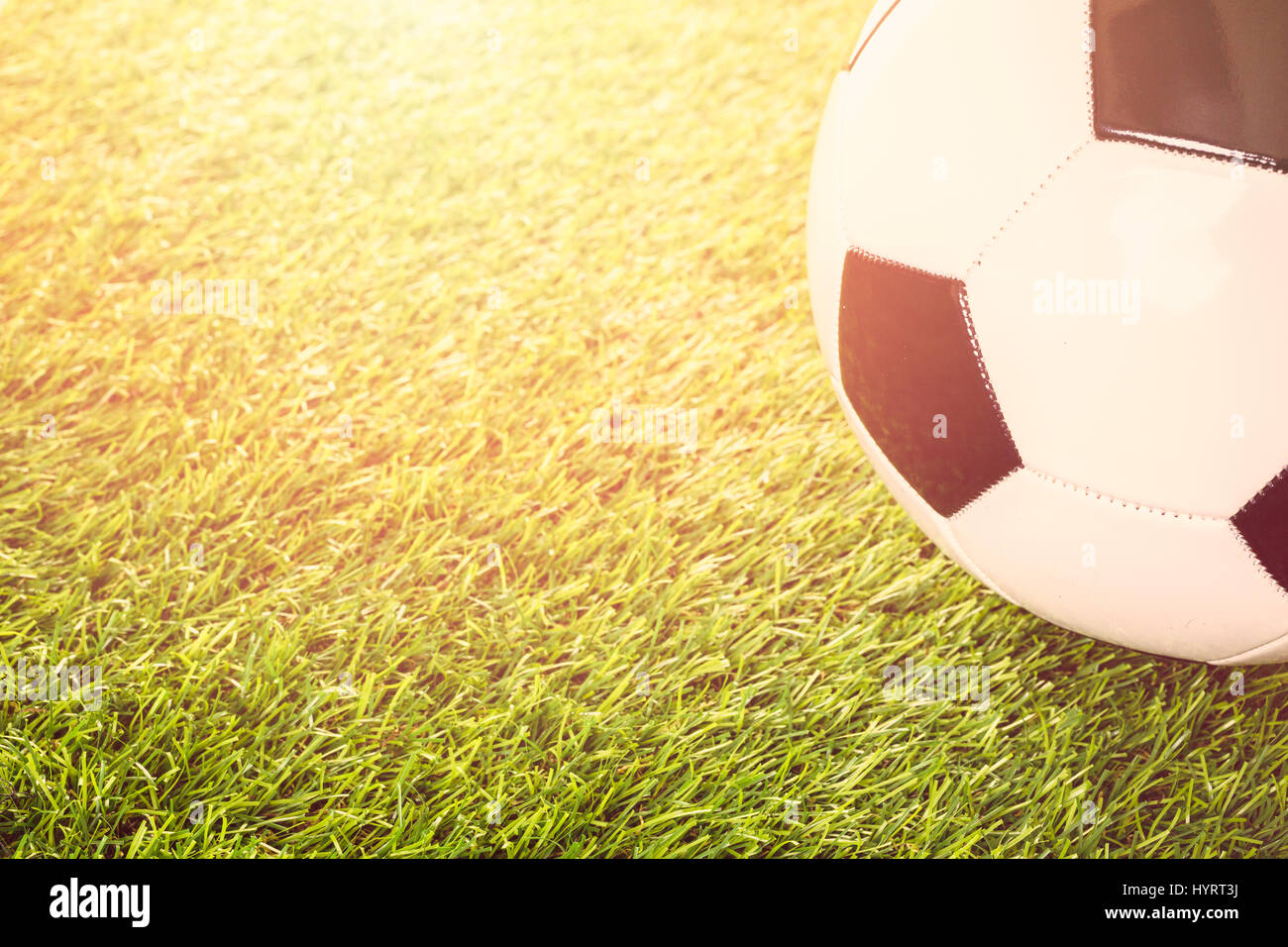 Football ball on a perfectly green grass Stock Photo - Alamy
