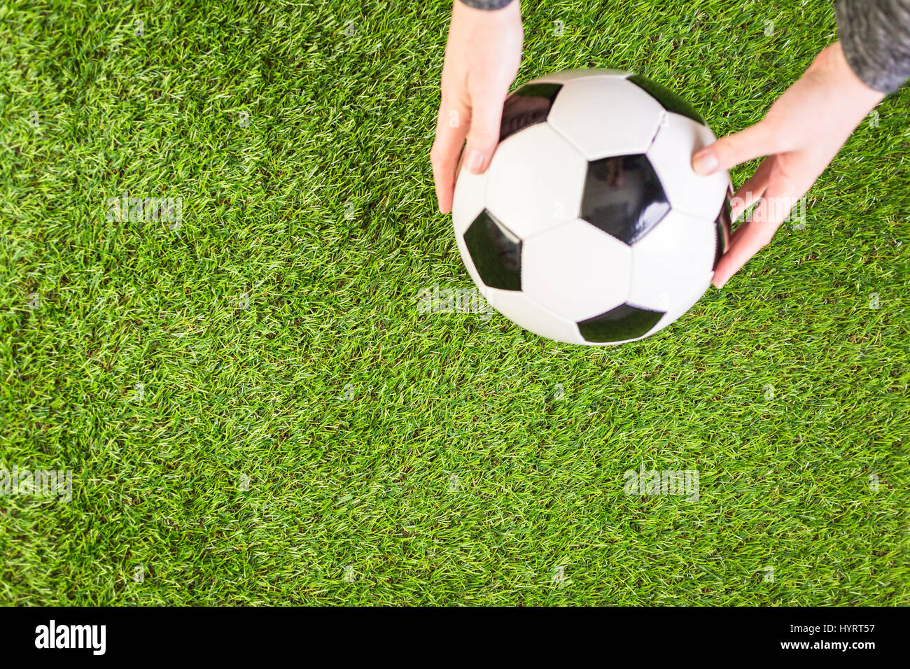 Soccer balls on a artificial turf as background Stock Photo - Alamy