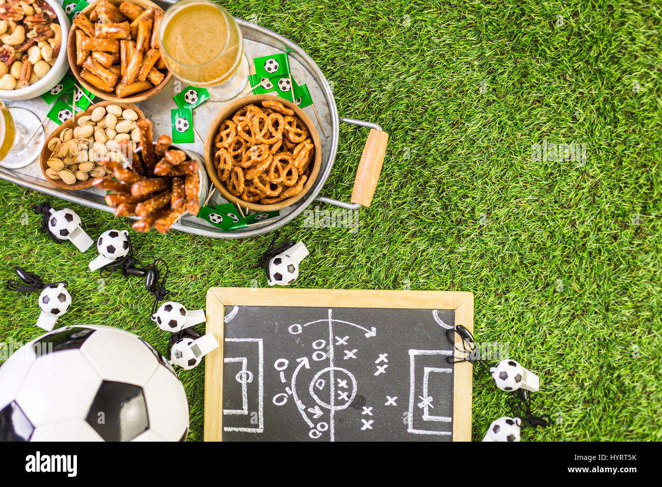 salty snacks and drinks on the metal tray for soccer party Stock Photo ...