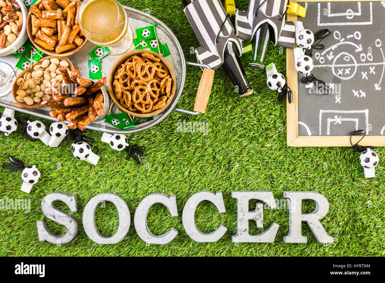 salty snacks and drinks on the metal tray for soccer party Stock Photo ...
