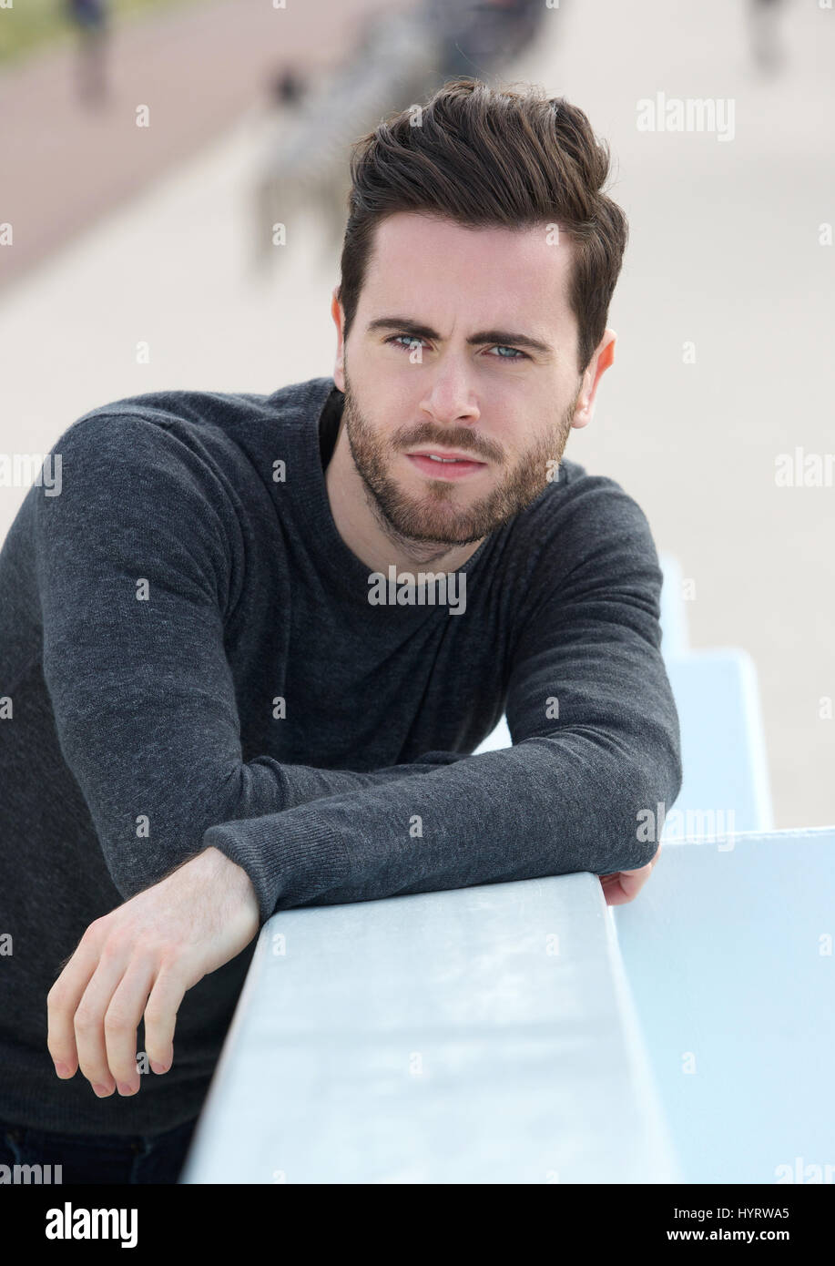 Serious man standing outdoors hi-res stock photography and images - Alamy