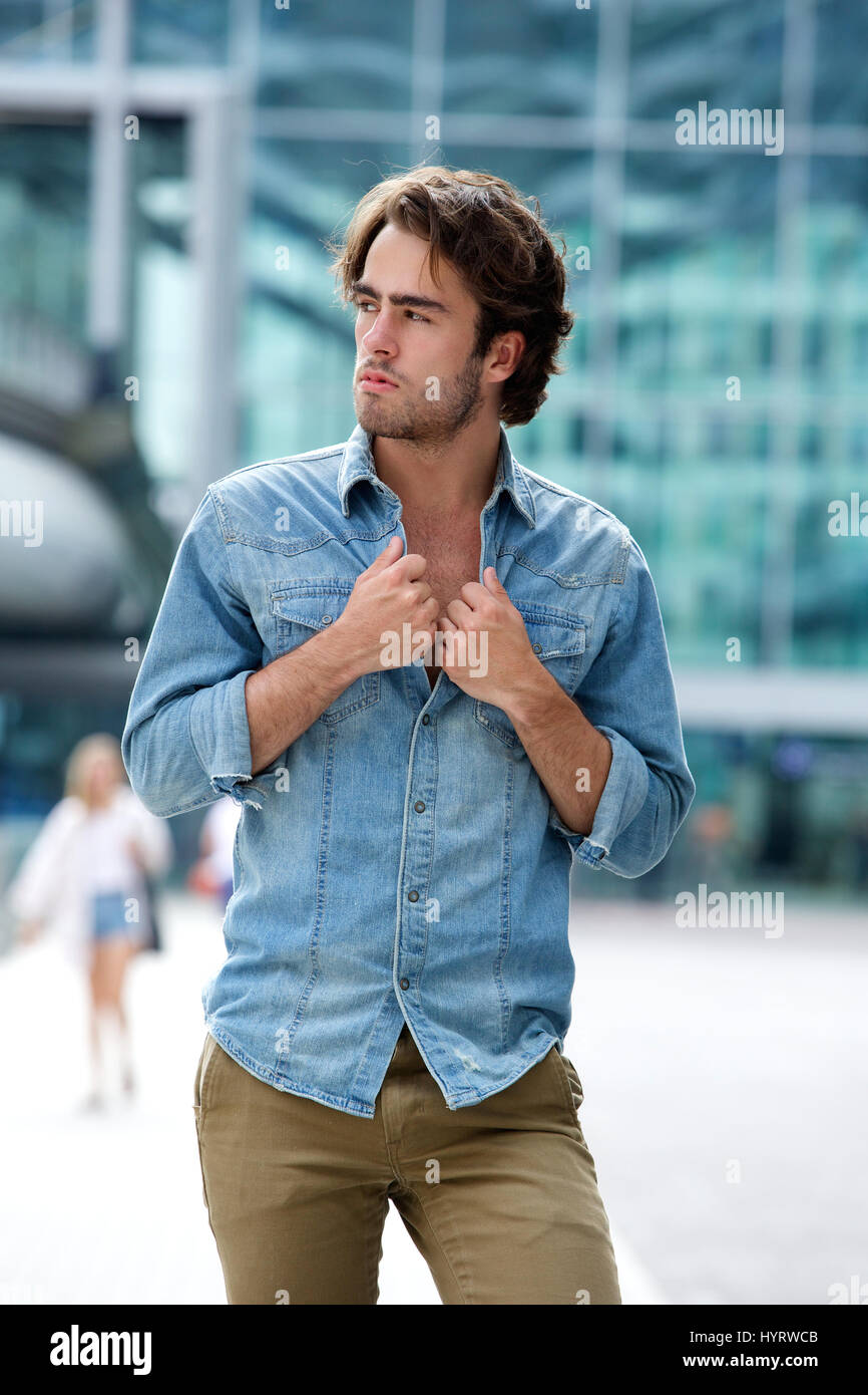Portrait of a handsome young man posing outdoors Stock Photo - Alamy