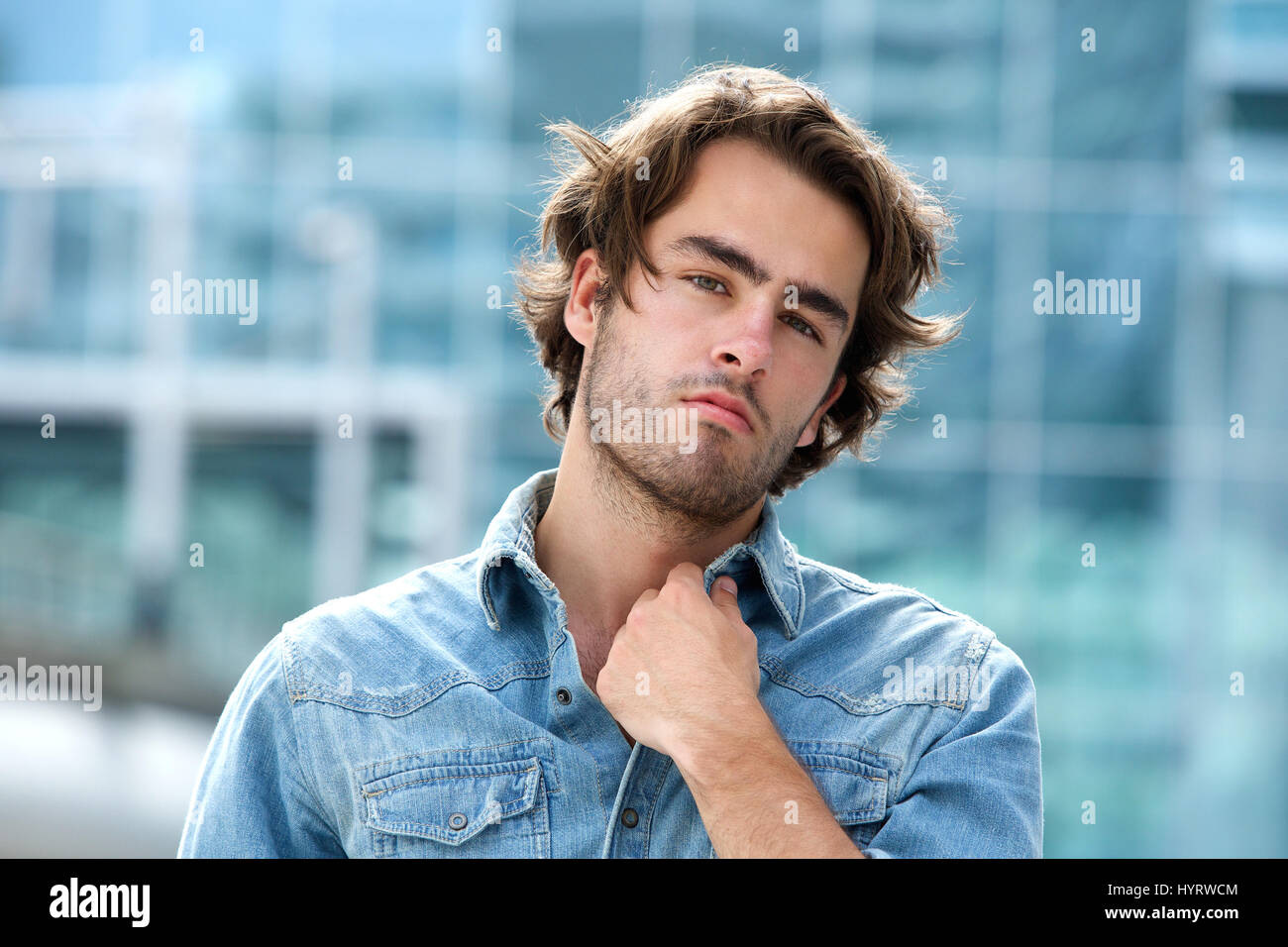Close up portrait of an attractive young man posing outdoors Stock ...