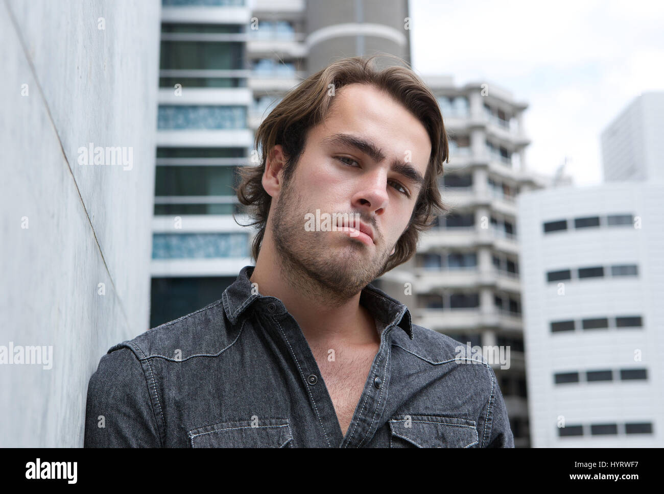 Close up portrait of a handsome young man posing outdoors Stock Photo ...