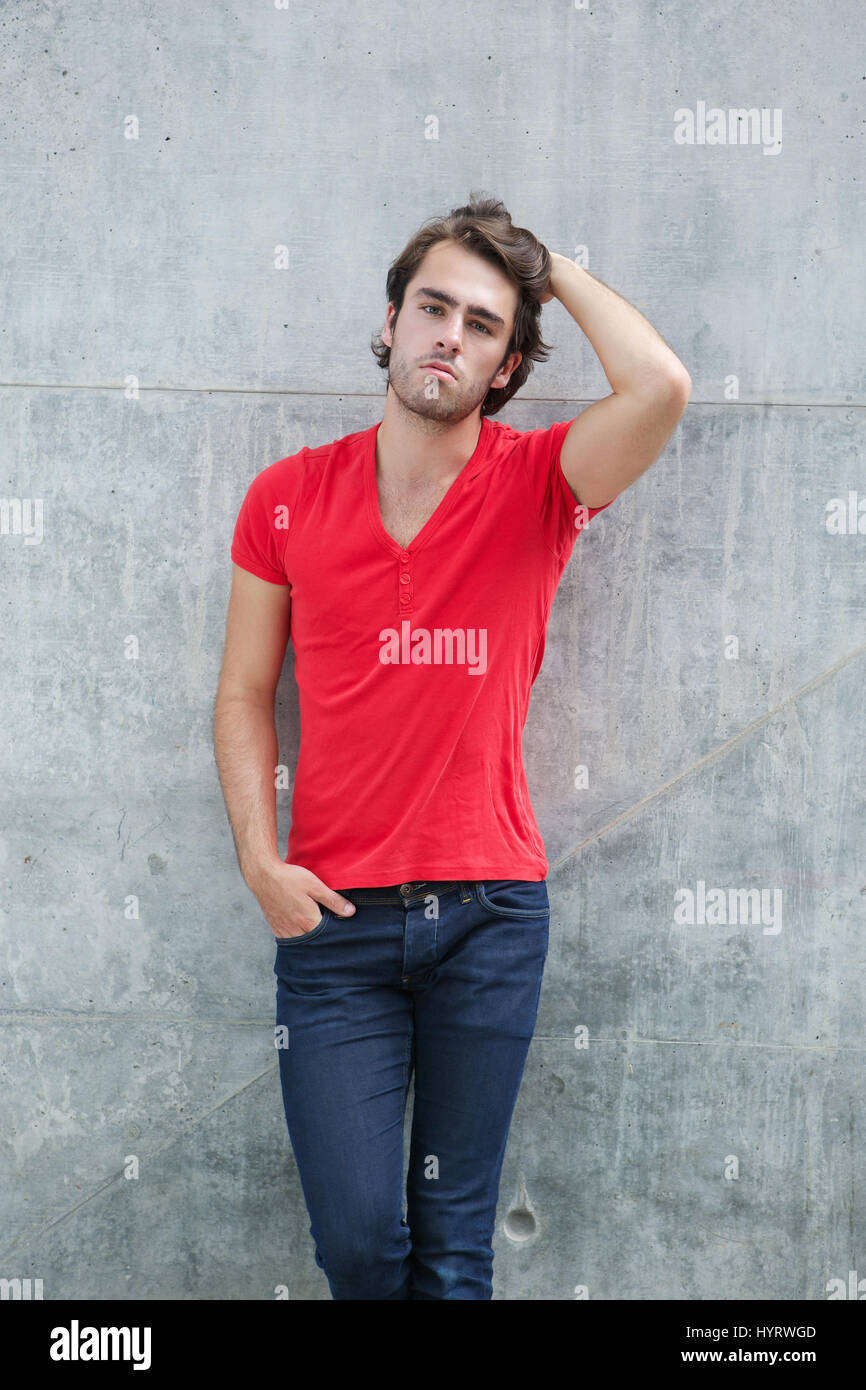 Portrait of a male fashion model with hand in hair Stock Photo - Alamy