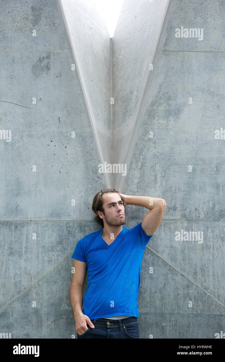 Portrait of a male fashion model in blue shirt Stock Photo - Alamy