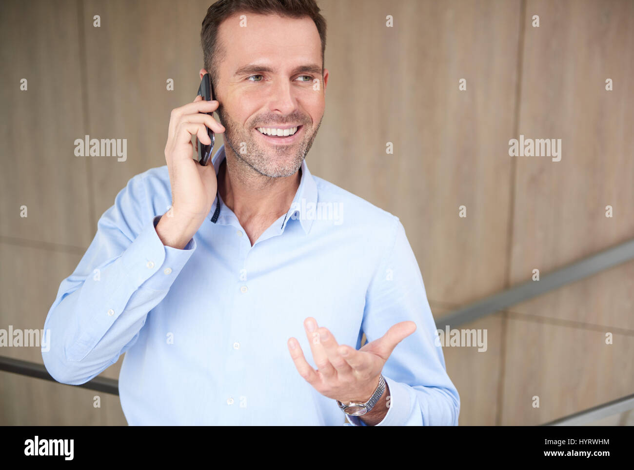Businessman talking on the phone at work Stock Photo - Alamy