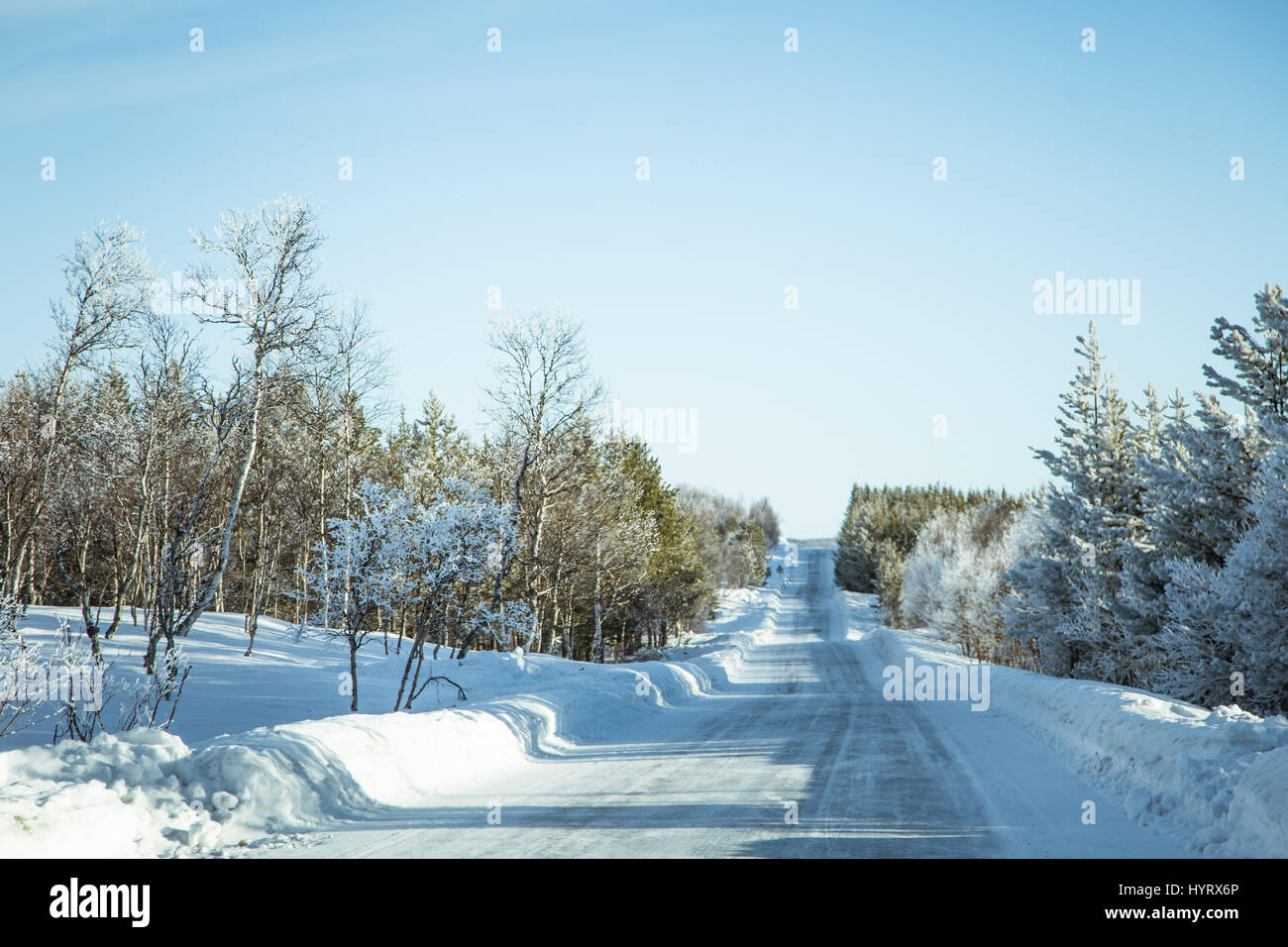 A beautiful landscape with a white road in the Norwegian winter Stock ...