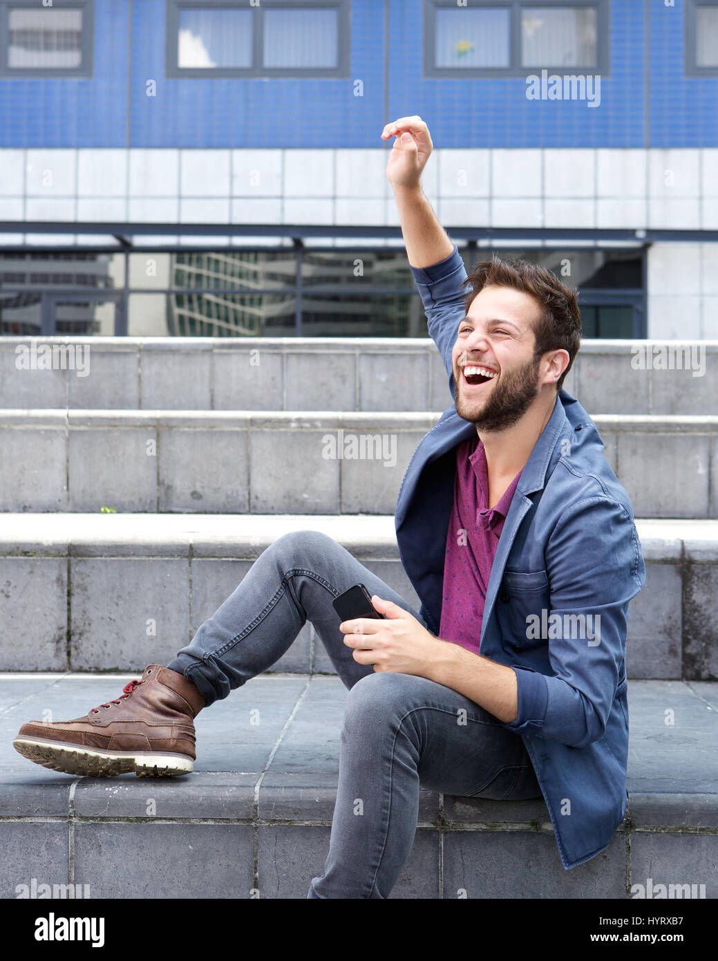 Cheerful young man holding hi-res stock photography and images - Alamy