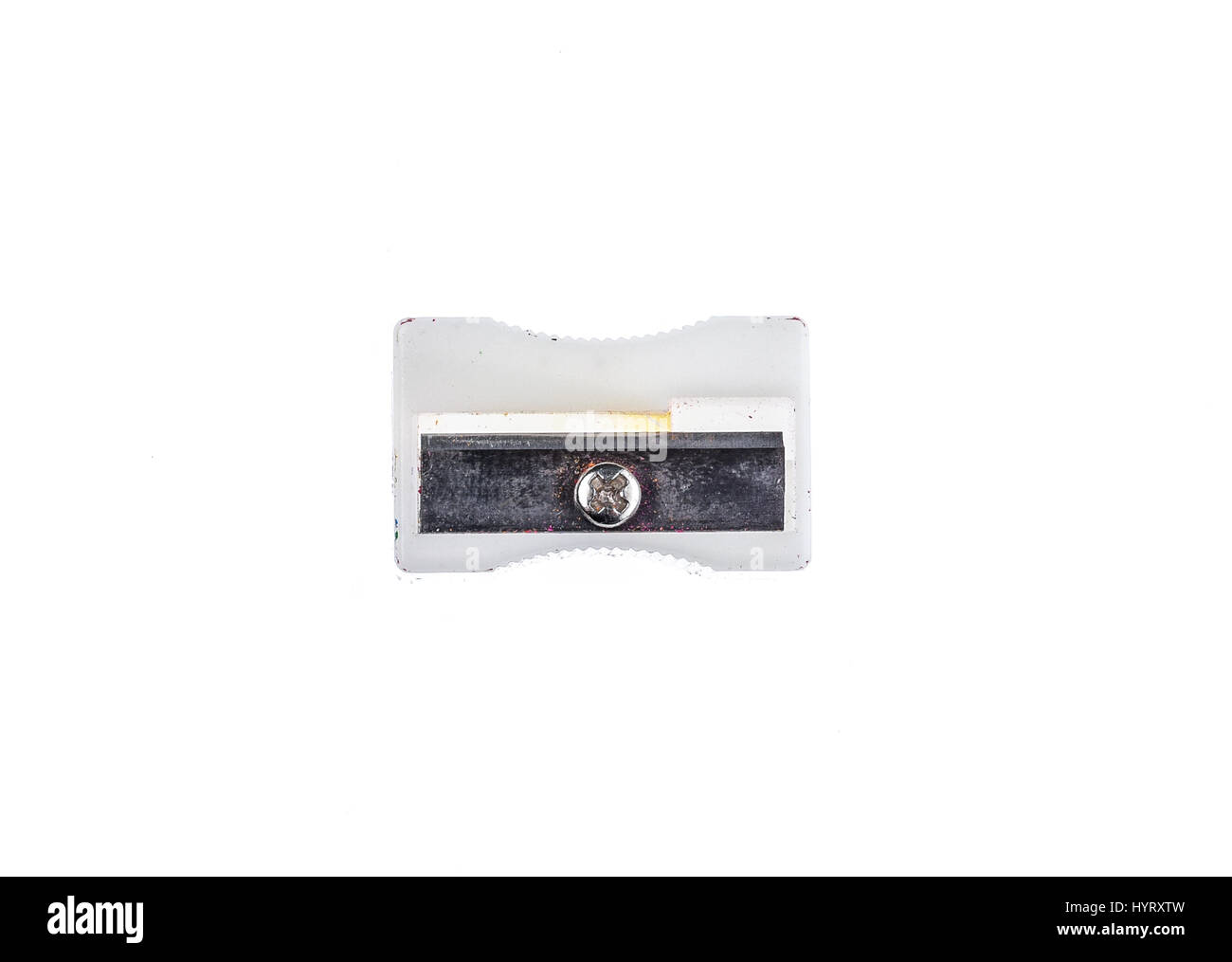 Old used white plastic pencil sharpener isolated on white. One hole ...