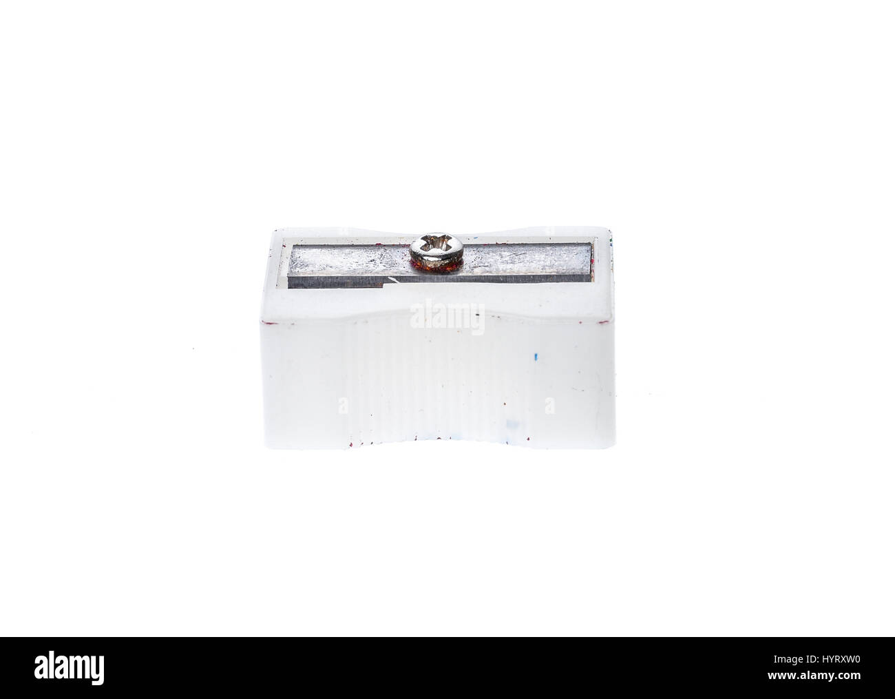 Old used white plastic pencil sharpener isolated on white. One hole ...