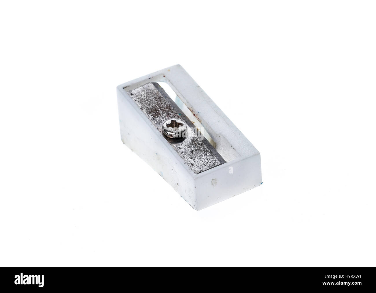 Old used white plastic pencil sharpener isolated on white. One hole ...